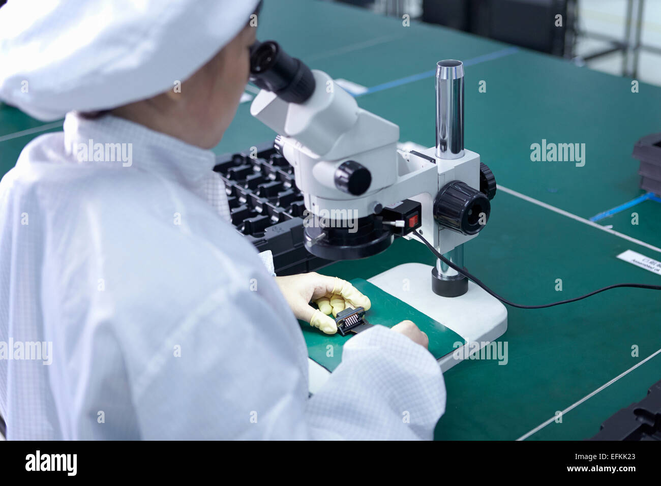 Asian lab technician on microscope hi-res stock photography and images ...