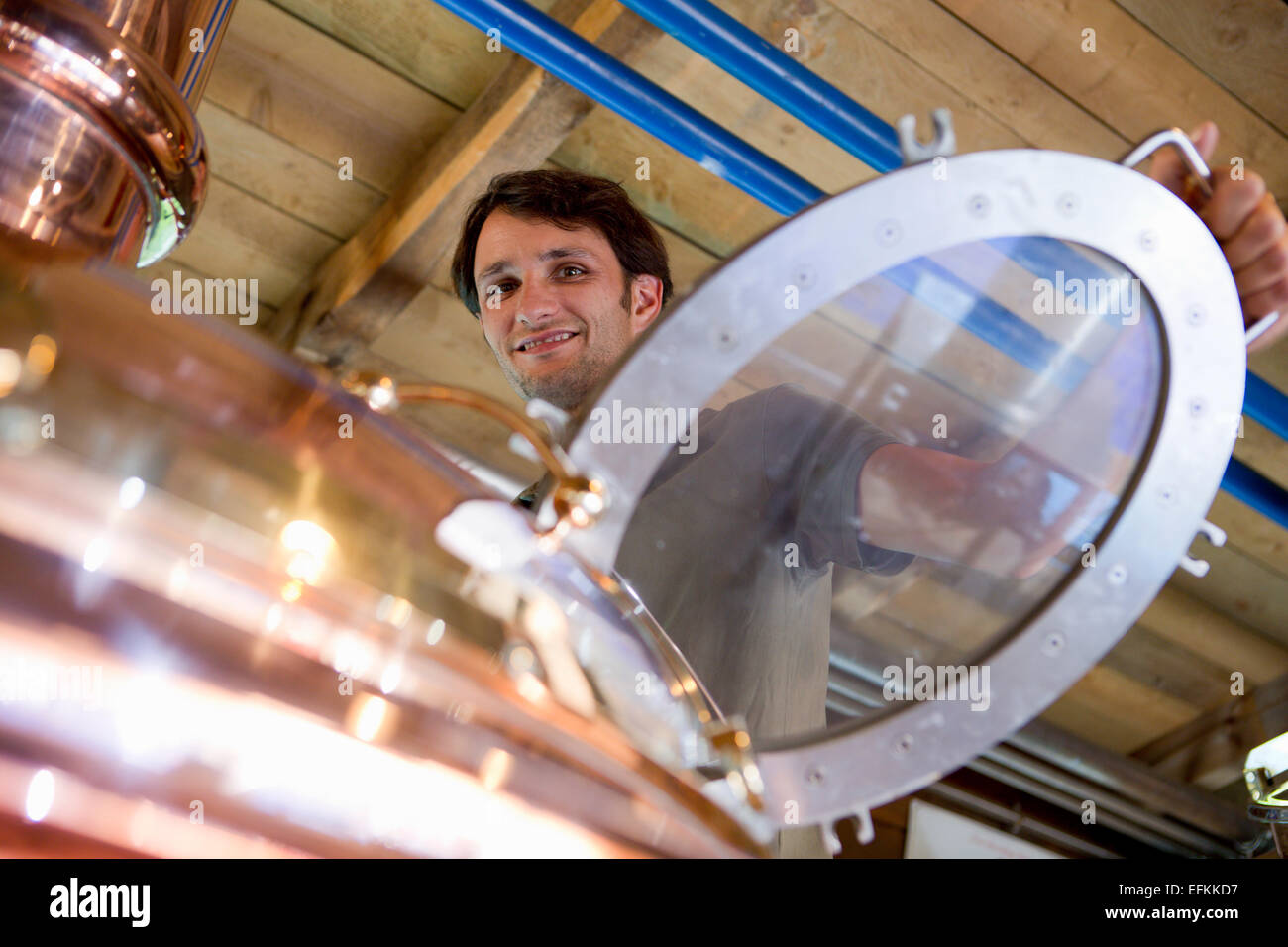Male brewer working in brewhouse Stock Photo - Alamy