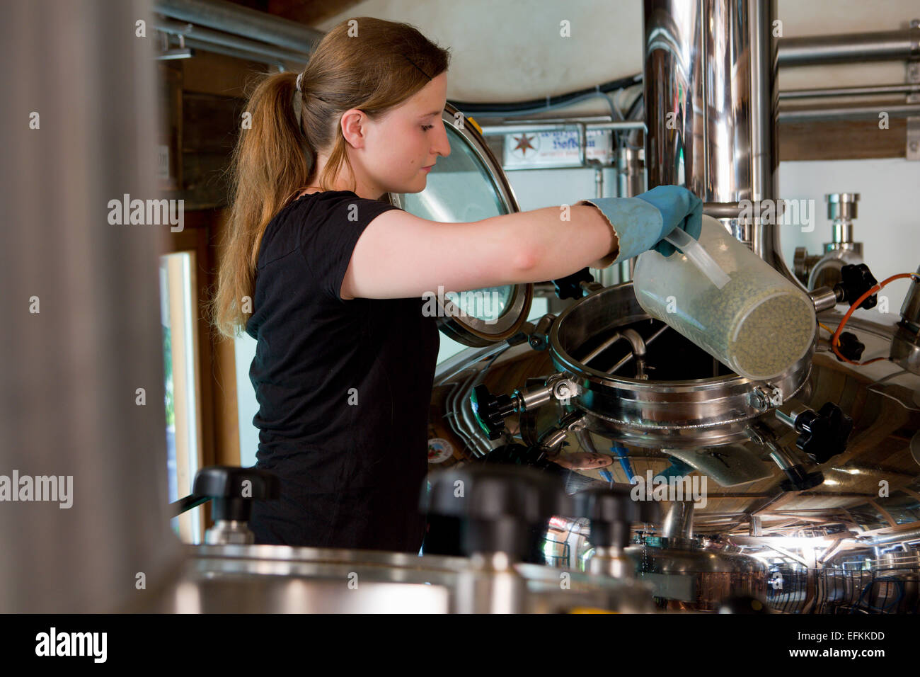 Female brewer working in brewhouse Stock Photo - Alamy