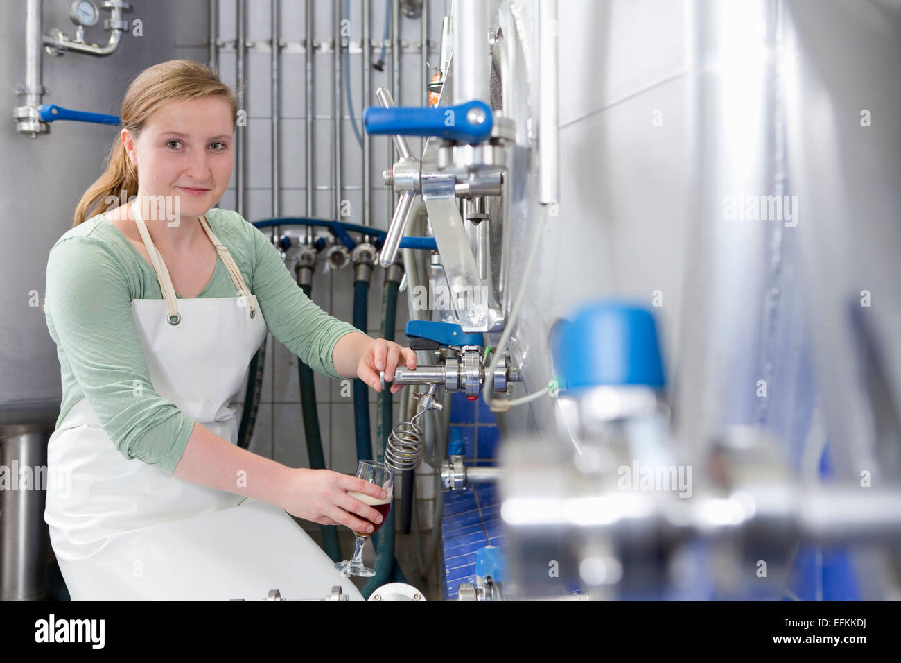 Female brewer working in brewhouse Stock Photo - Alamy