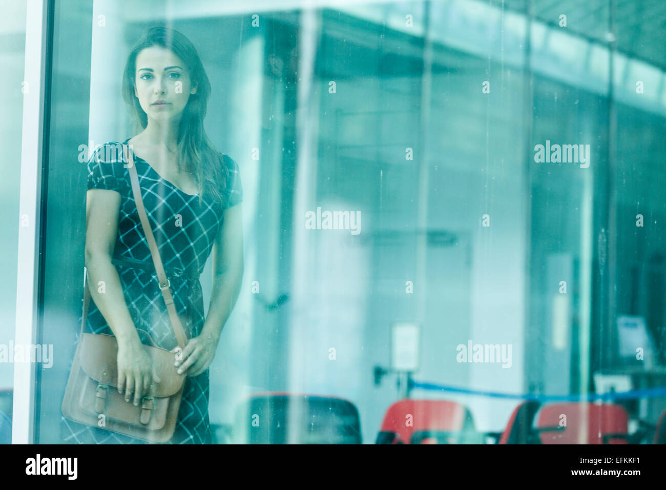 Woman behind glass window Stock Photo - Alamy