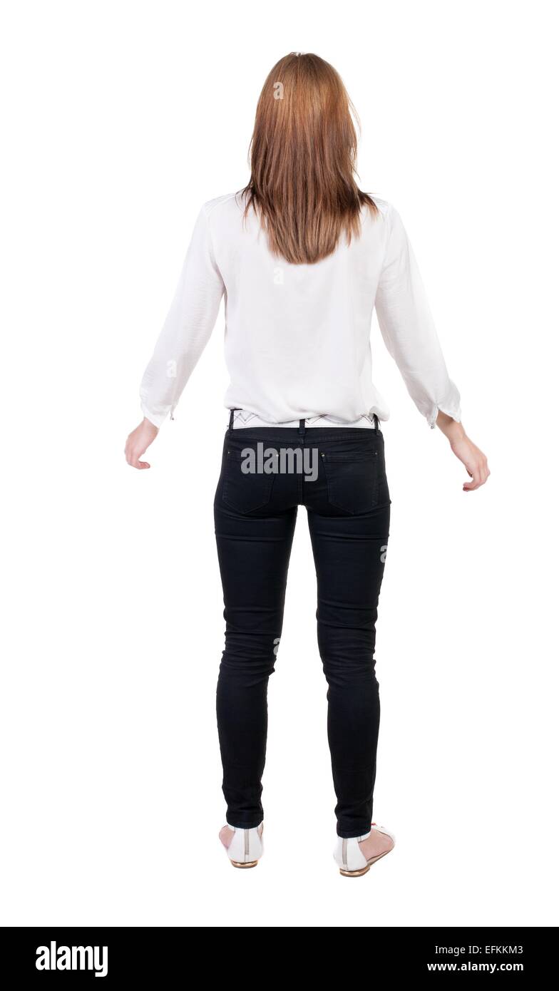 back view of standing young beautiful blonde woman in jeans. girl ...