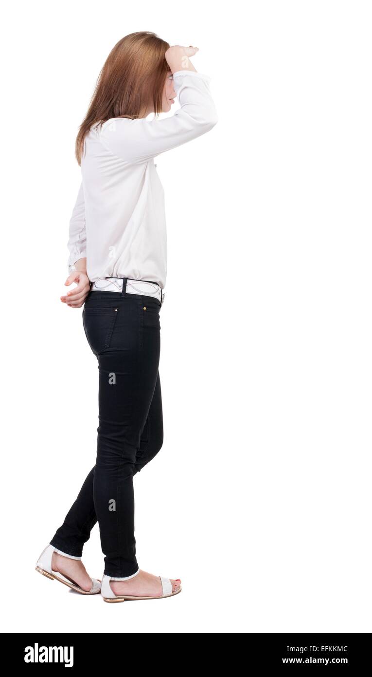 back view of standing young beautiful blonde woman in jeans. girl ...