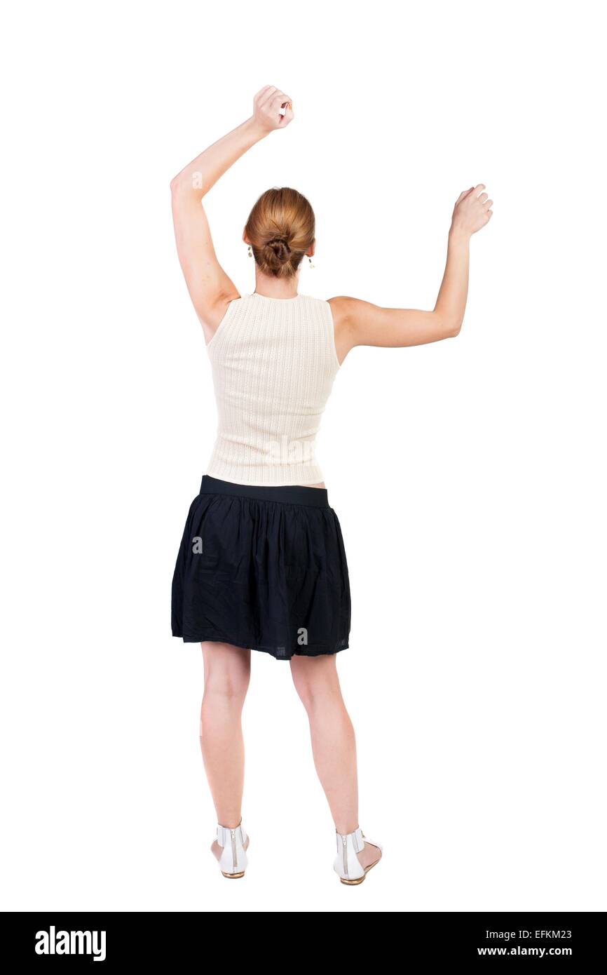 Back view of joyful woman celebrating victory hands up. Rear view ...