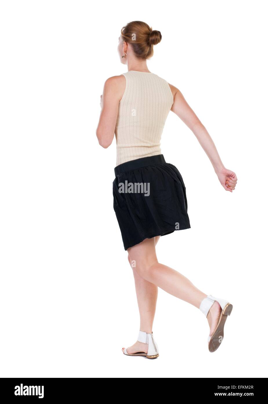 back view of running woman in dress. beautiful blonde girl in motion ...