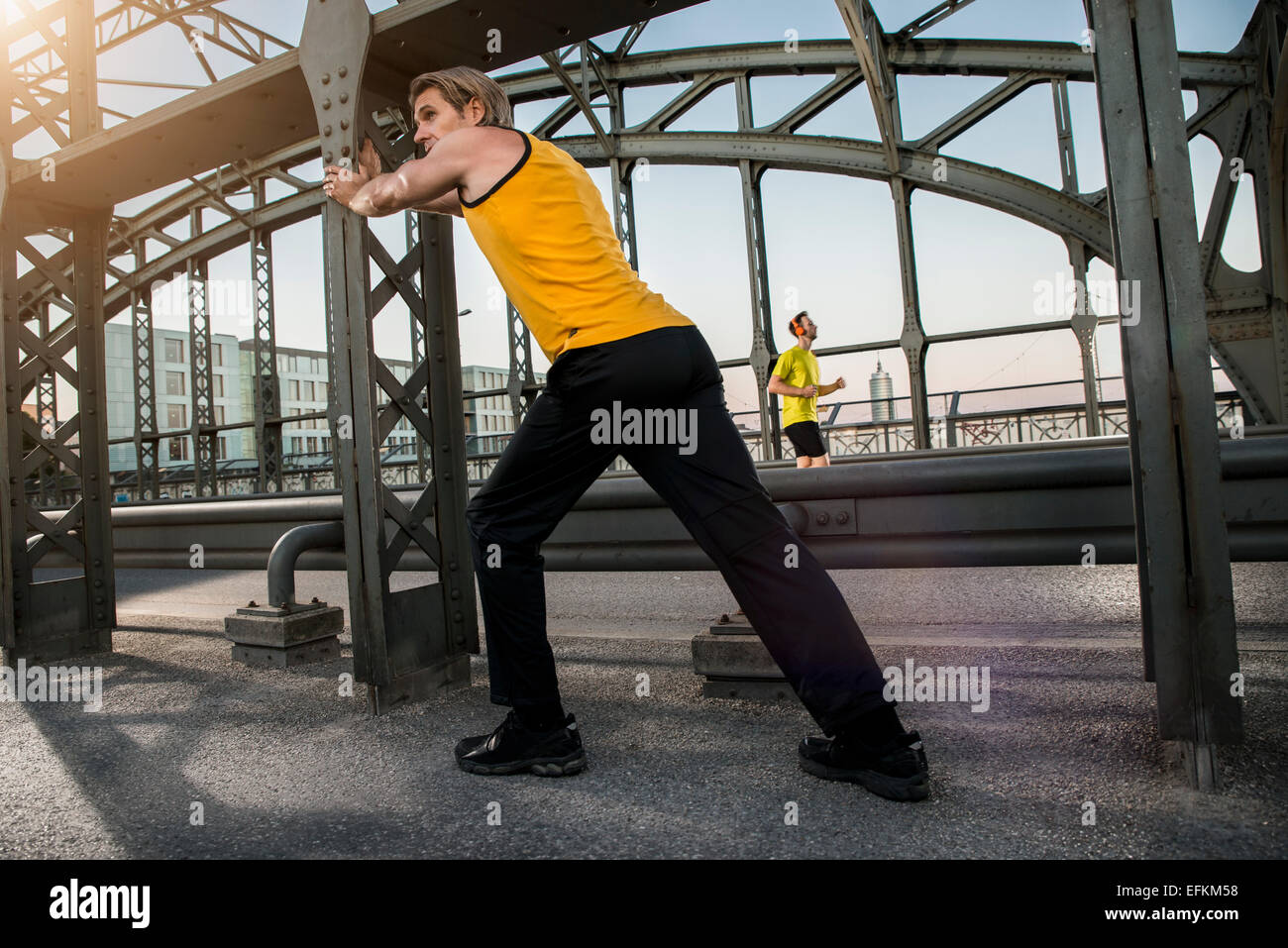 Man stretching on bridge munich hi-res stock photography and images - Alamy