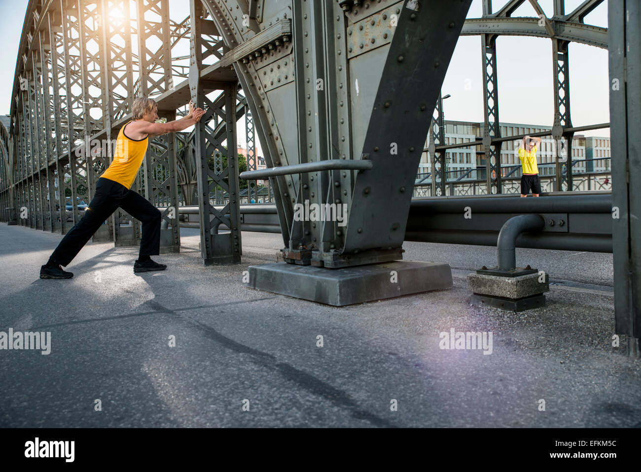 Man stretching on bridge munich hi-res stock photography and images - Alamy