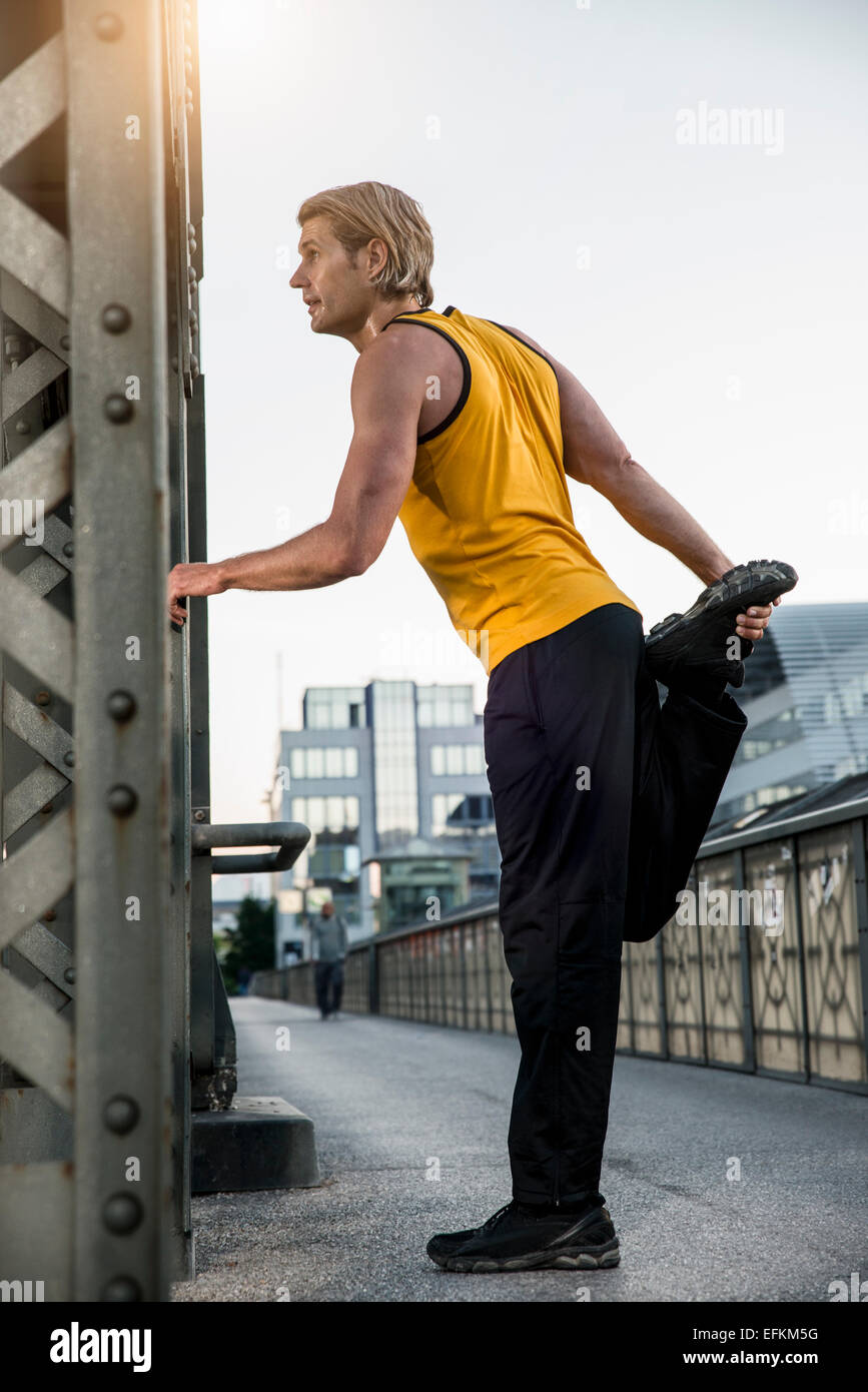 Man stretching on bridge munich hi-res stock photography and images - Alamy
