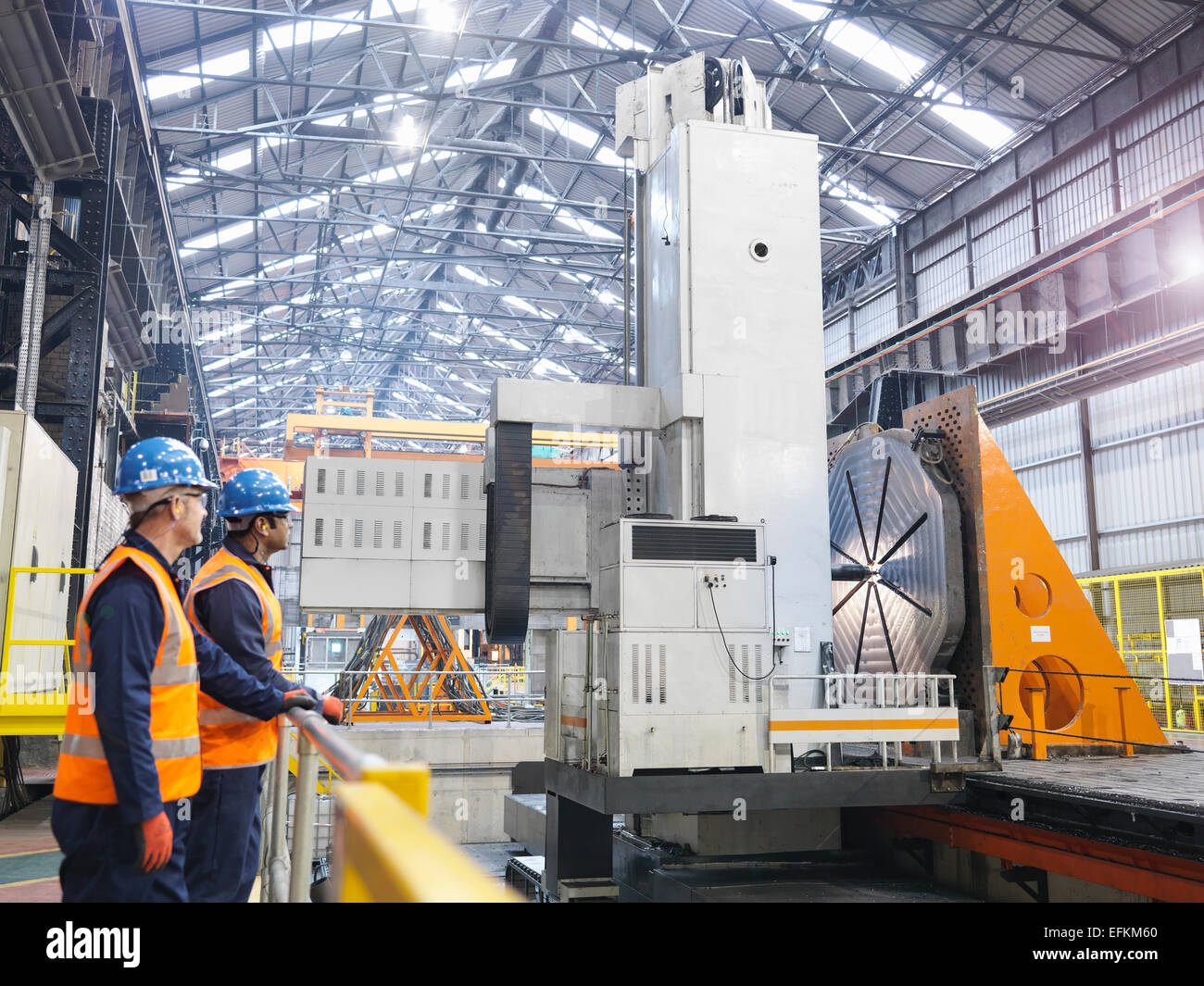 Steelworkers with gantry milling machine in engineering factory Stock ...