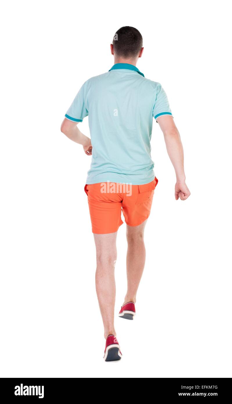 Back view of running sportsman. Man in blue t-shirt and orange shorts ...