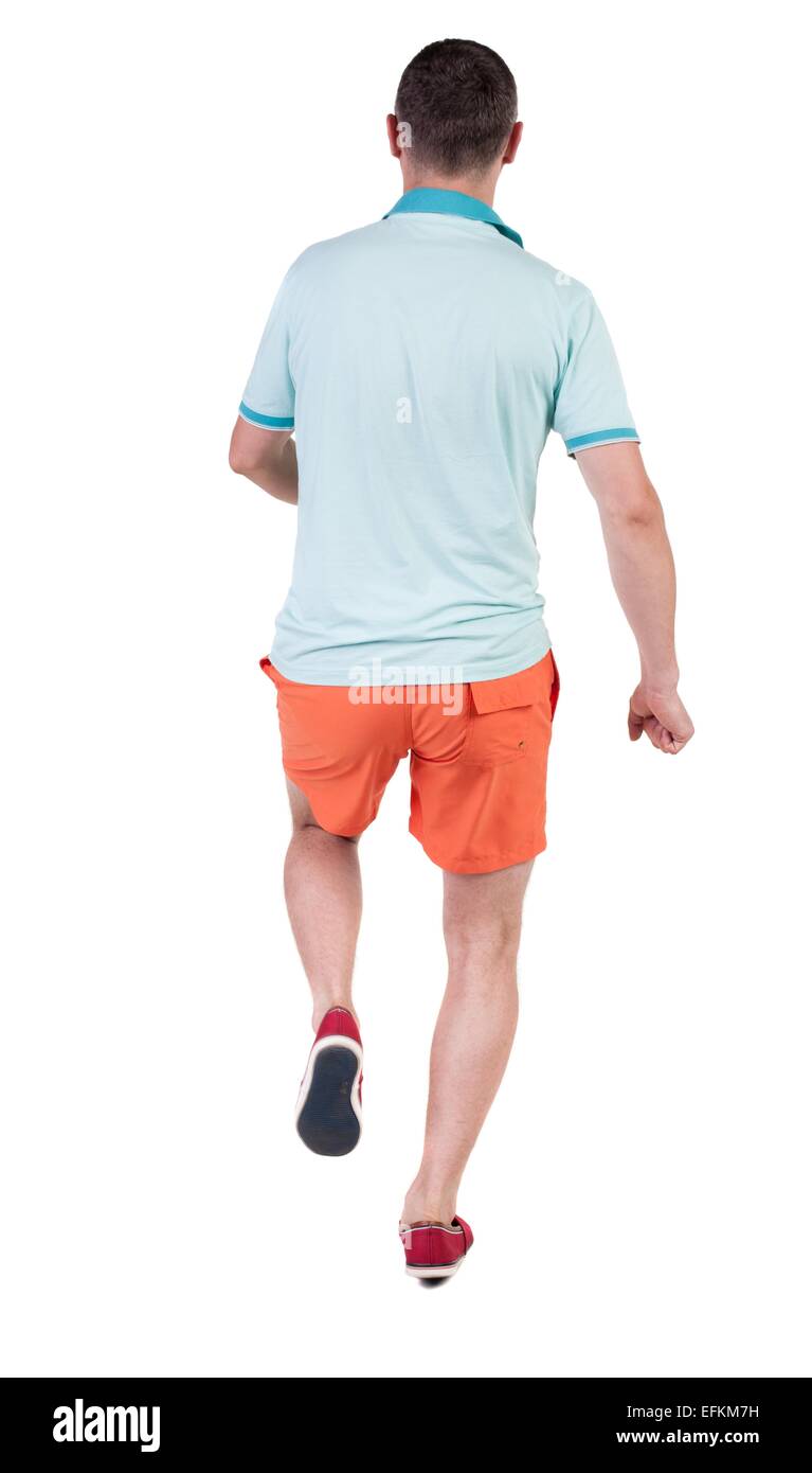 Back view of running sportsman. Man in blue t-shirt and orange shorts ...