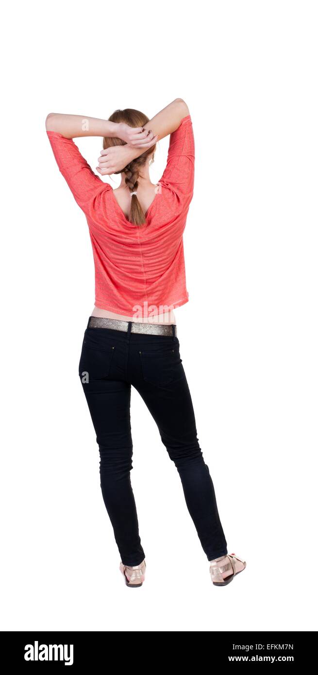 back view of standing young beautiful blonde woman in jeans. girl ...