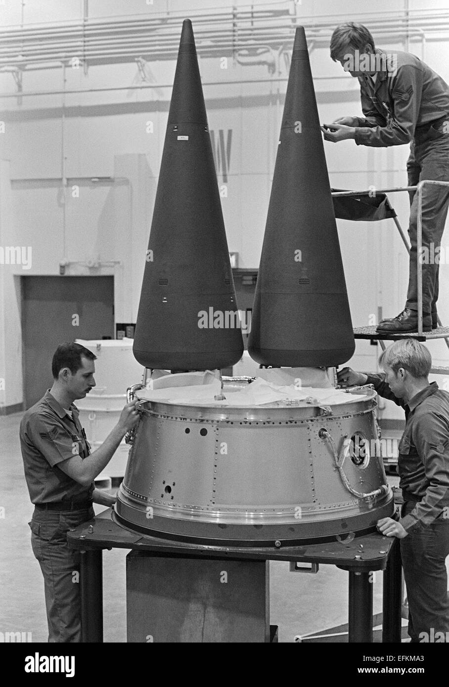 An Air Force Airman work on the warheads of an LGM-30G Minuteman III ...