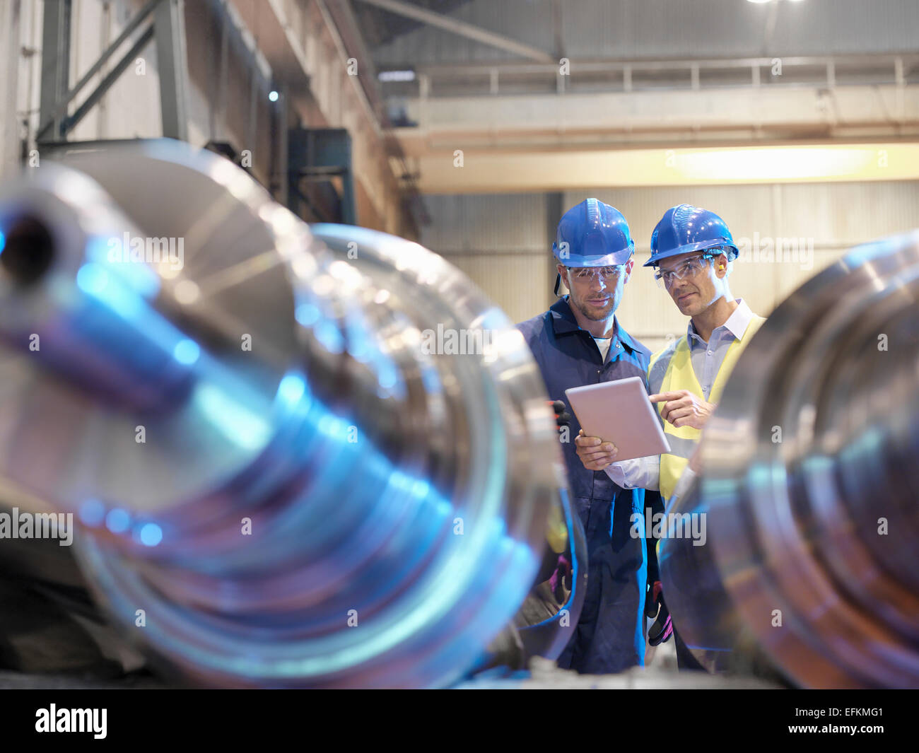 Two engineers looking at computer hi-res stock photography and images ...