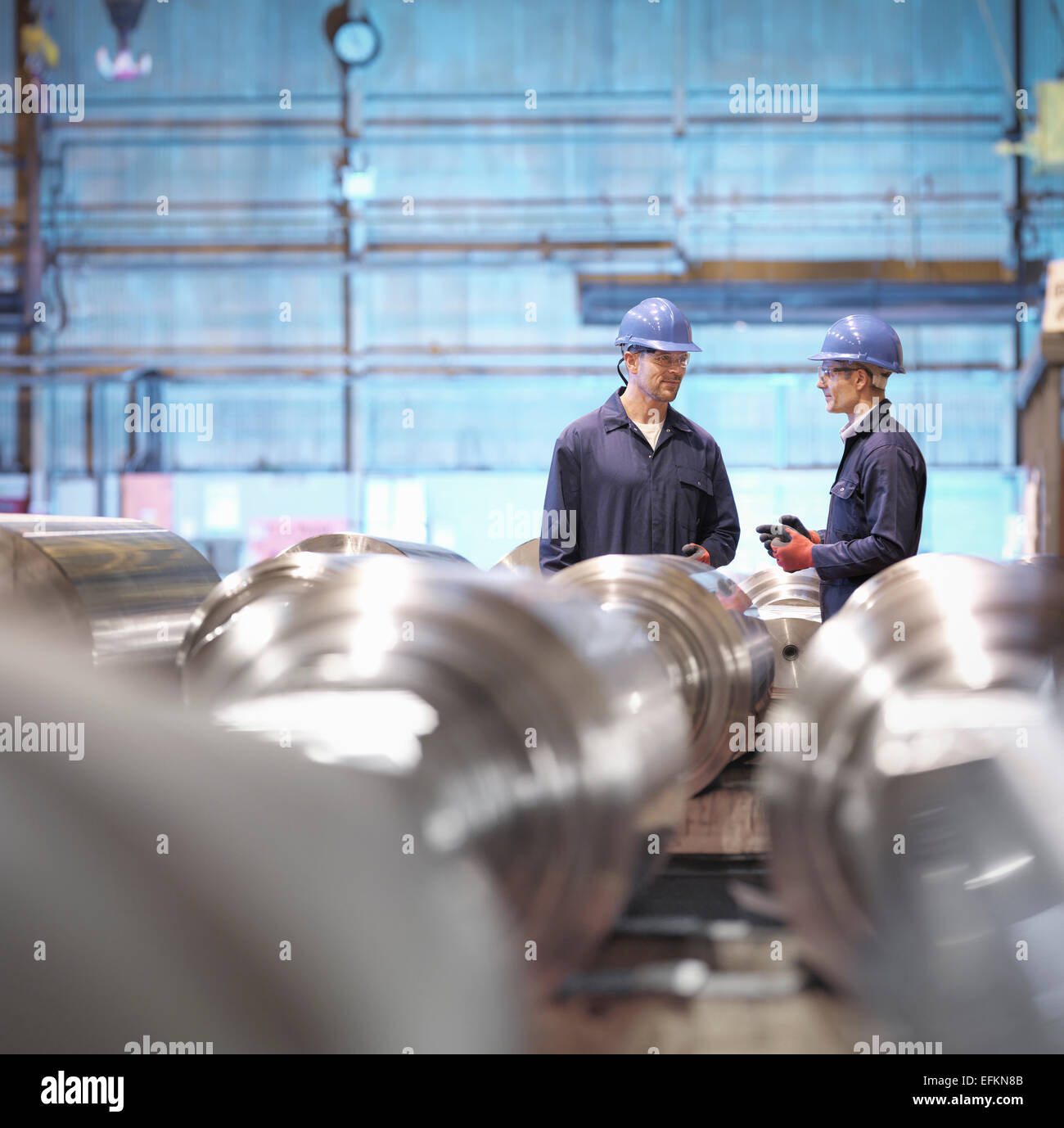 Man in hard hat talking to man in suit hi-res stock photography and ...