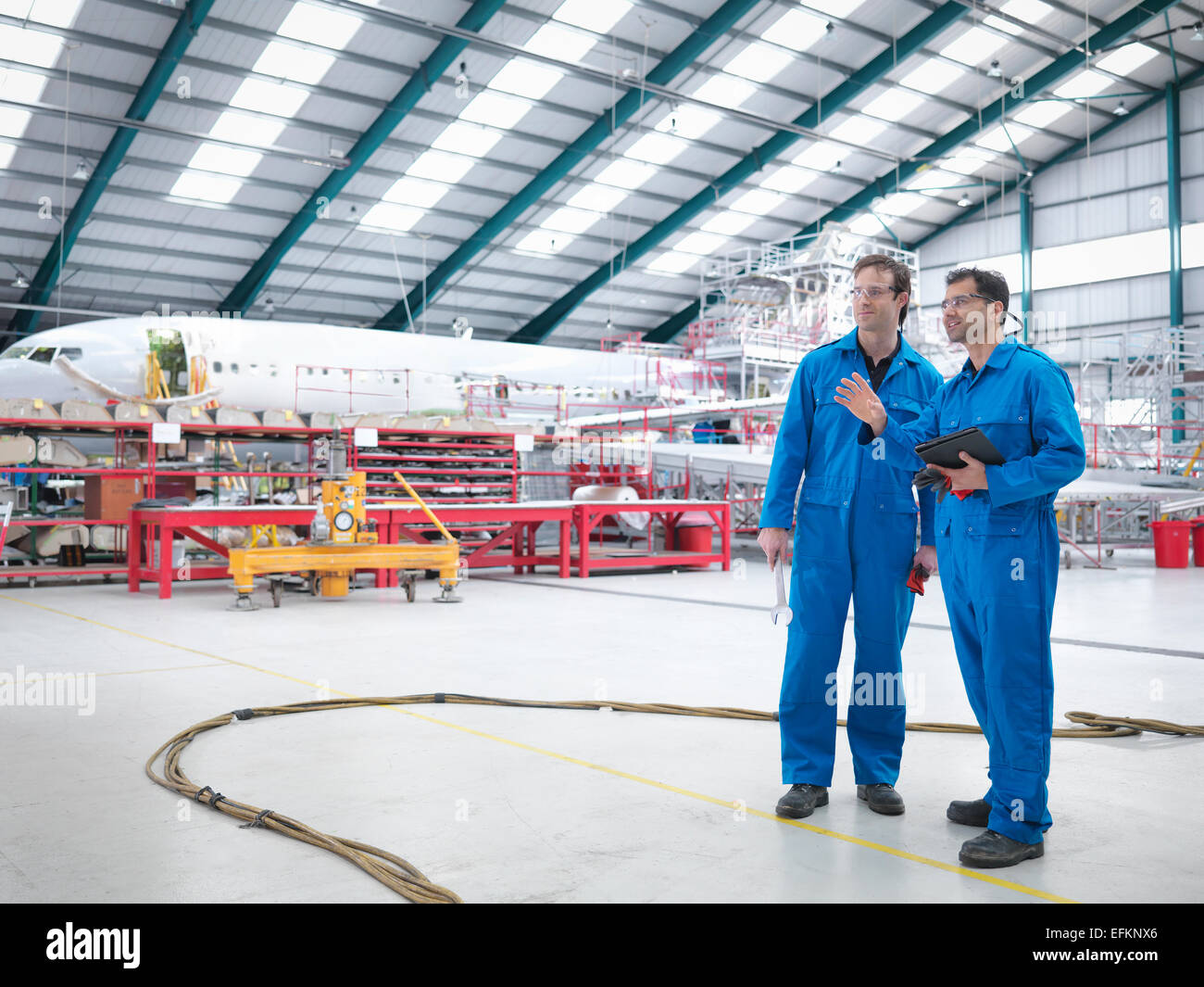 Two engineers looking at computer hi-res stock photography and images ...