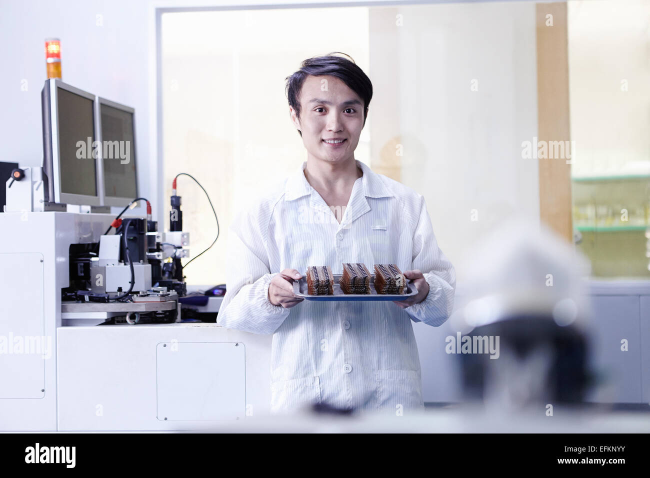 Technician working in LED factory Stock Photo - Alamy