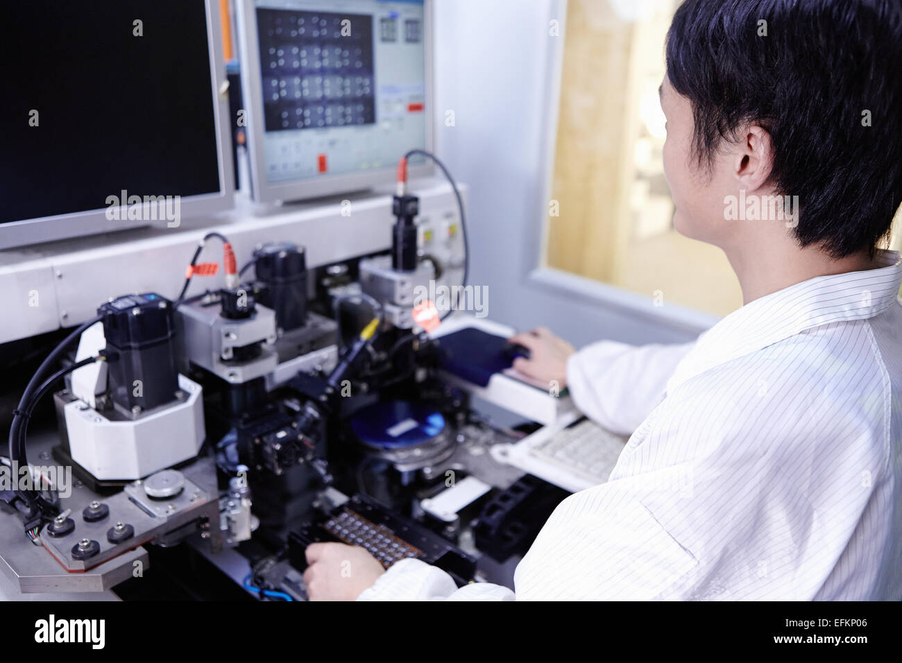 Technician working in LED factory Stock Photo - Alamy