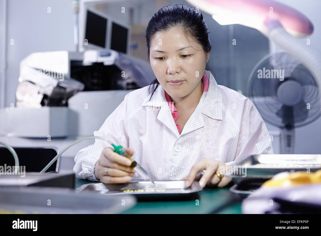 Technician working in LED factory Stock Photo - Alamy