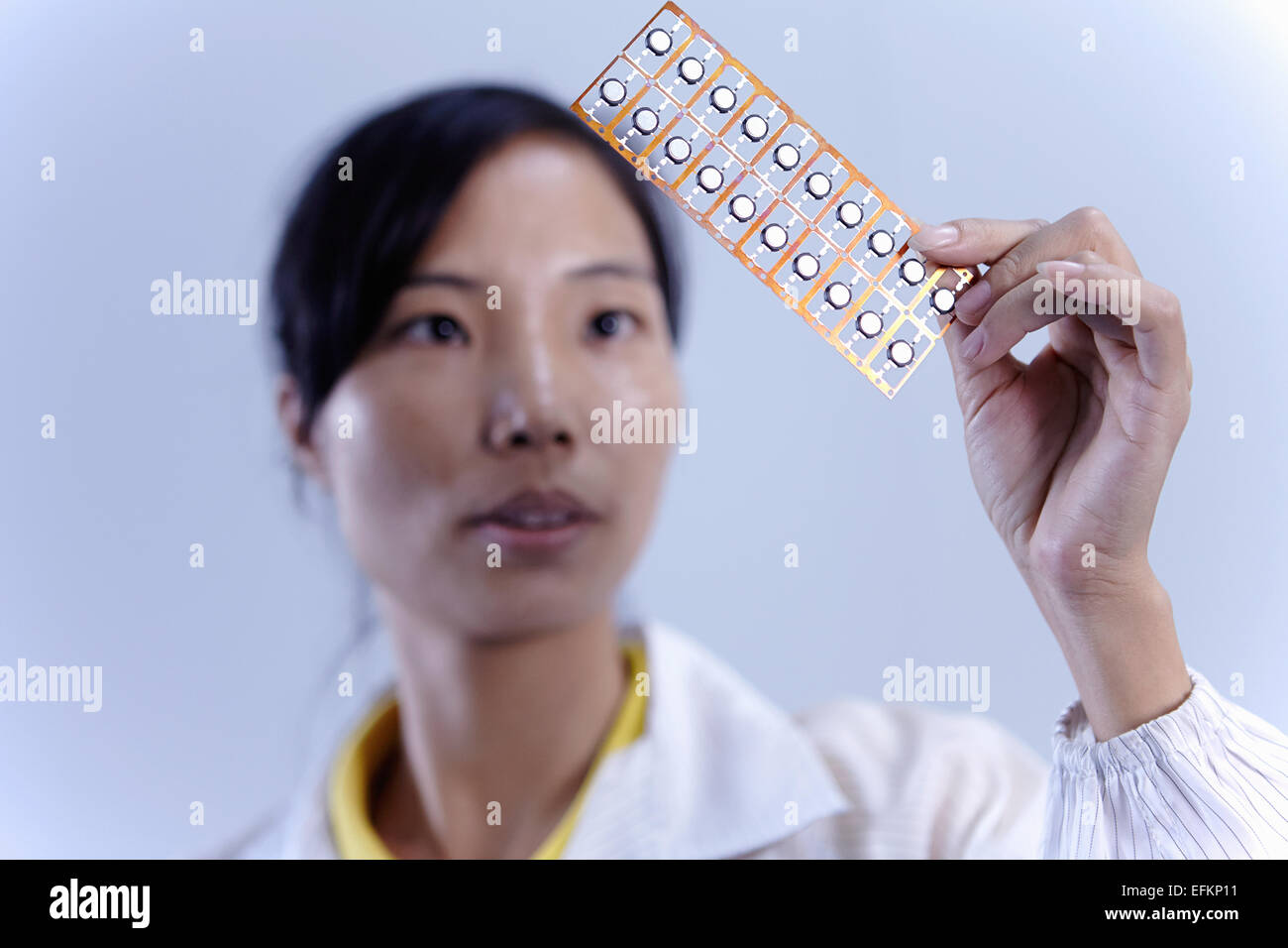 Technician working in LED factory Stock Photo - Alamy