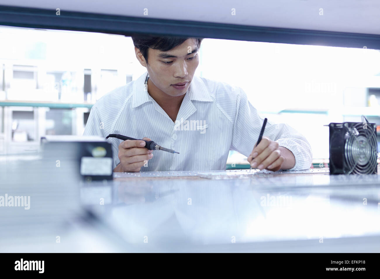Technician working in LED factory Stock Photo - Alamy