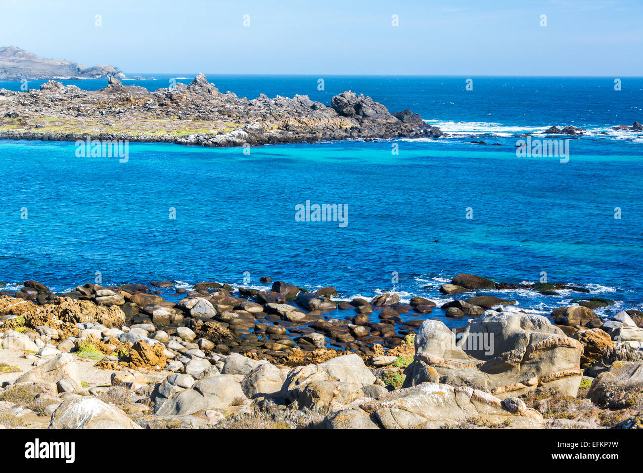 Beautiful blue water of the Pacific Ocean at Damas Island in Chile ...