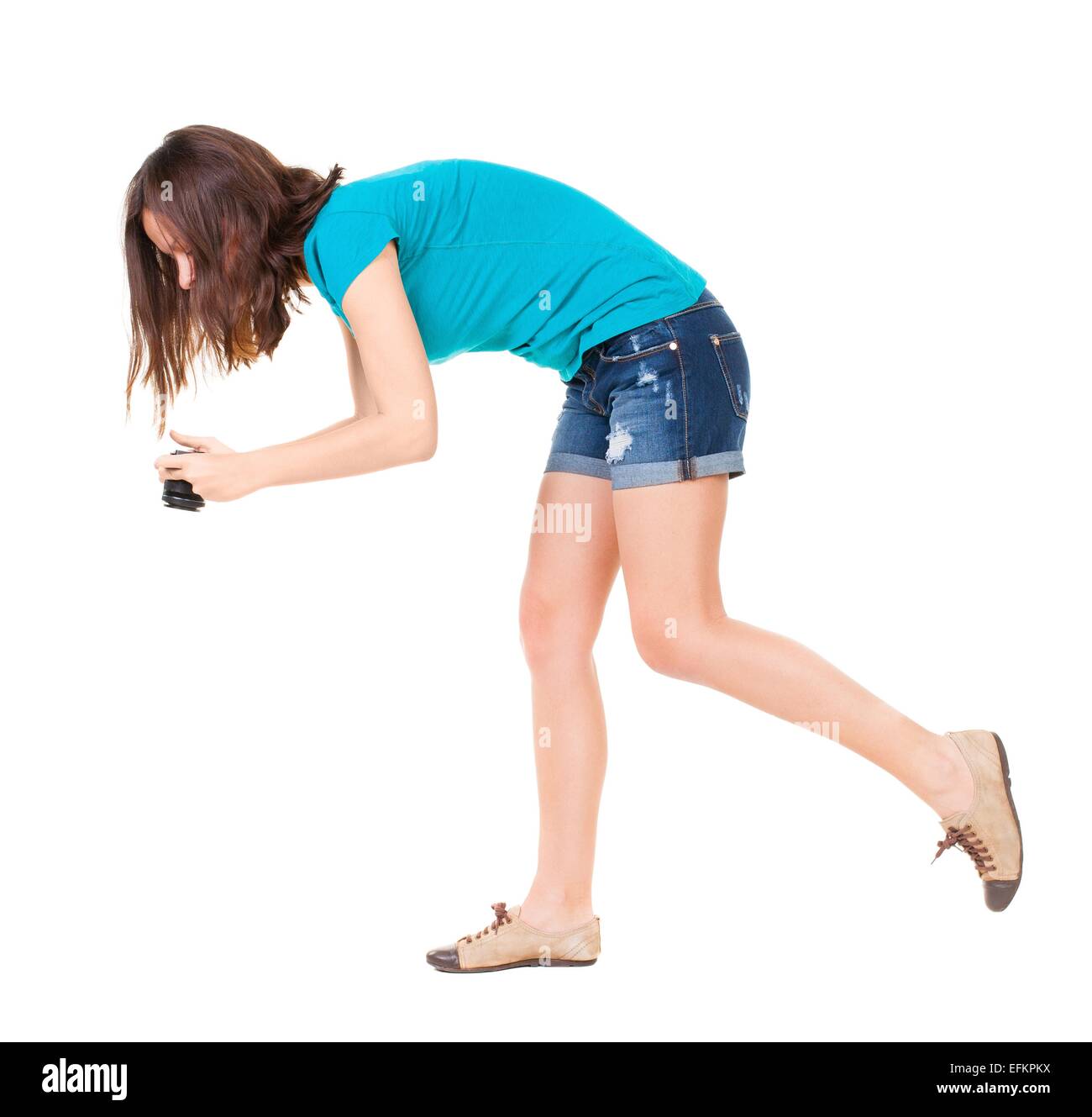 young woman in shorts photographed something compact camera. Isolated ...