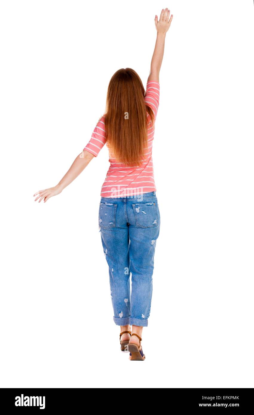 Back view of beautiful woman welcomes. Young teenager girl in jeans ...