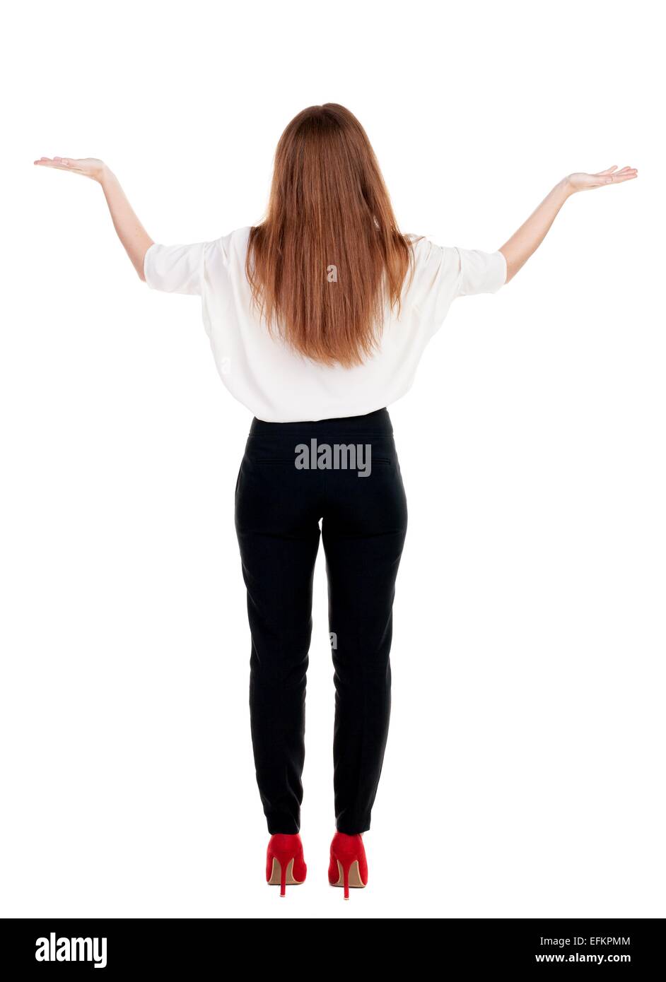 Back view of Beautiful business woman in suite looking at wall and ...