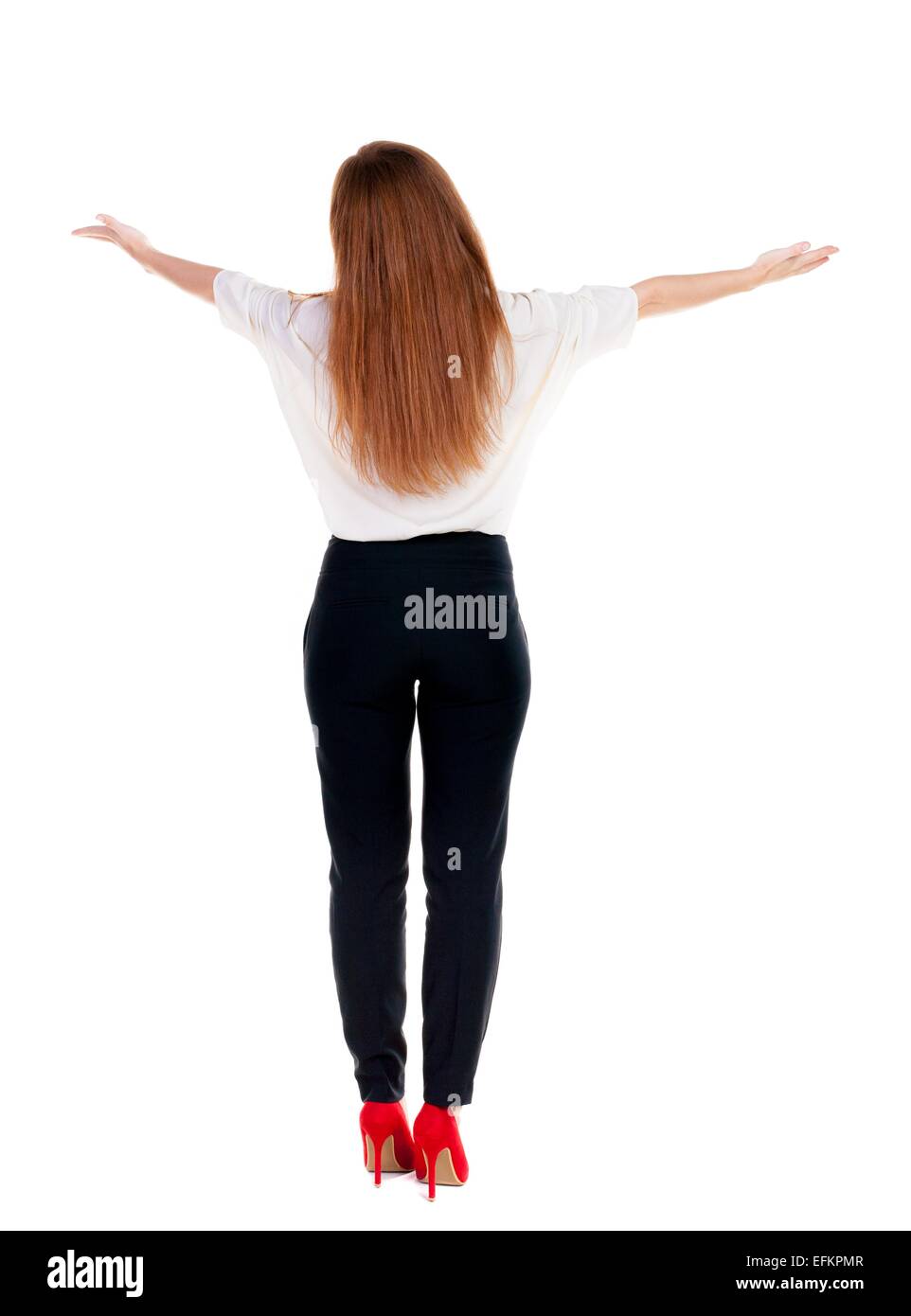 Back view of Beautiful business woman in suite looking at wall and ...