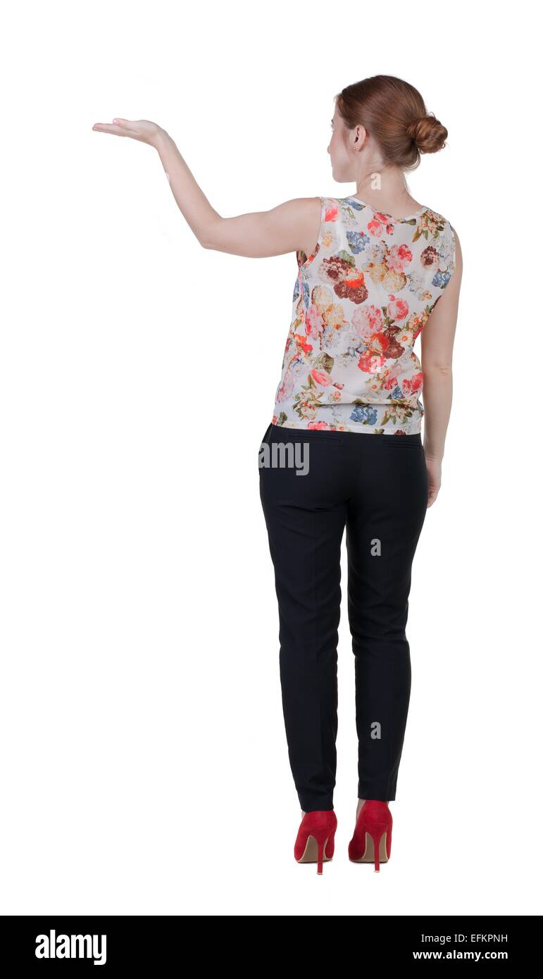 Back view of Beautiful business woman in suite looking at wall and ...