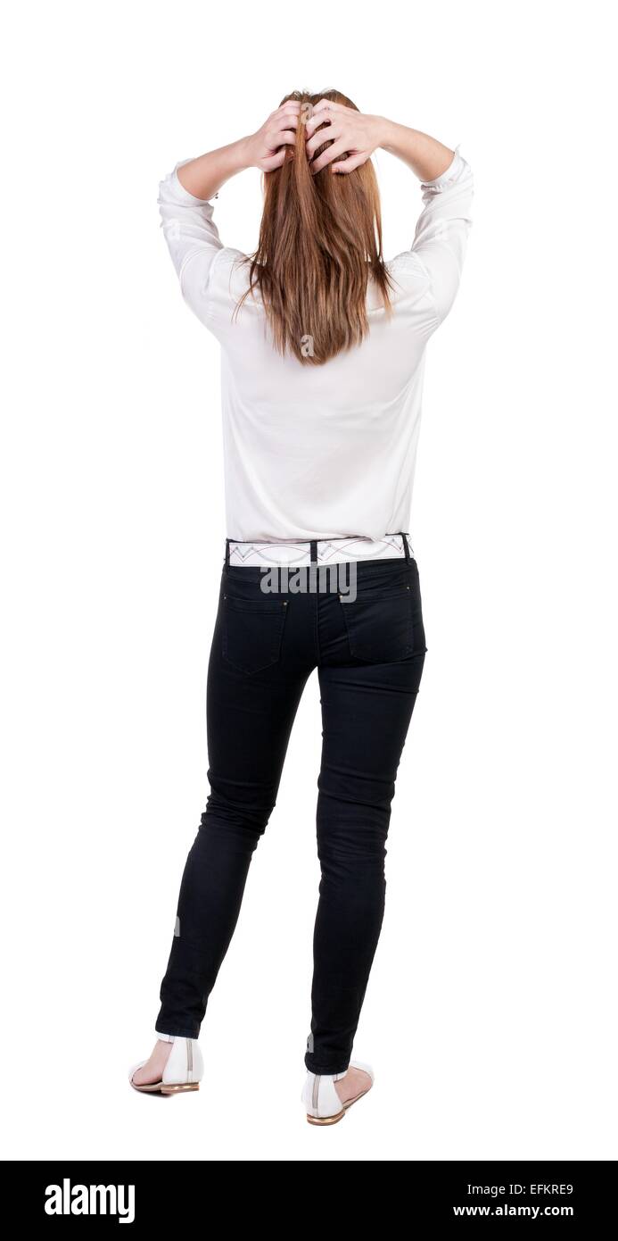 back view of standing young beautiful blonde woman in jeans. girl ...