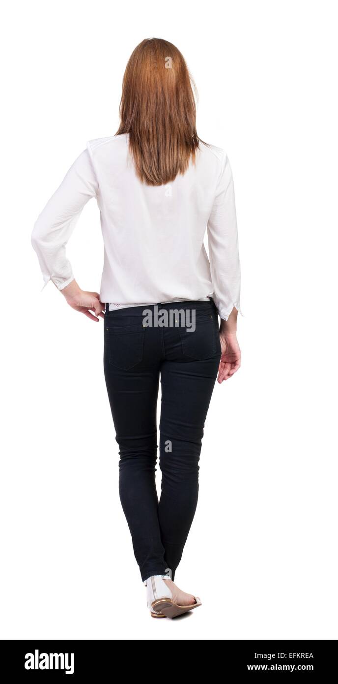 back view of standing young beautiful blonde woman in jeans. girl ...