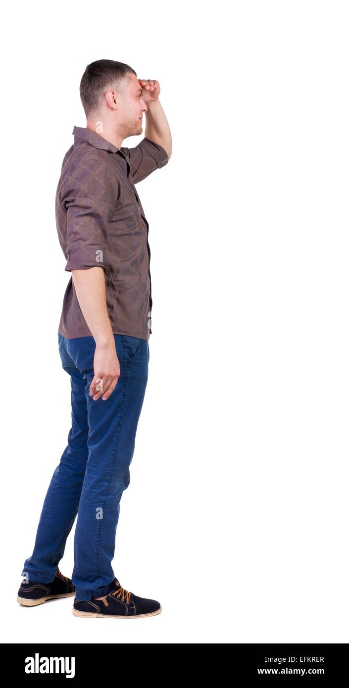 Back view of handsome man in shirt looking up. Standing young guy in ...