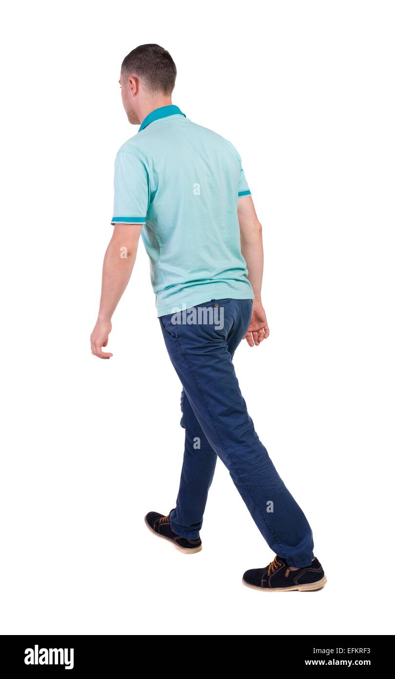 Back view of going handsome man in jeans and a shirt. walking young guy ...