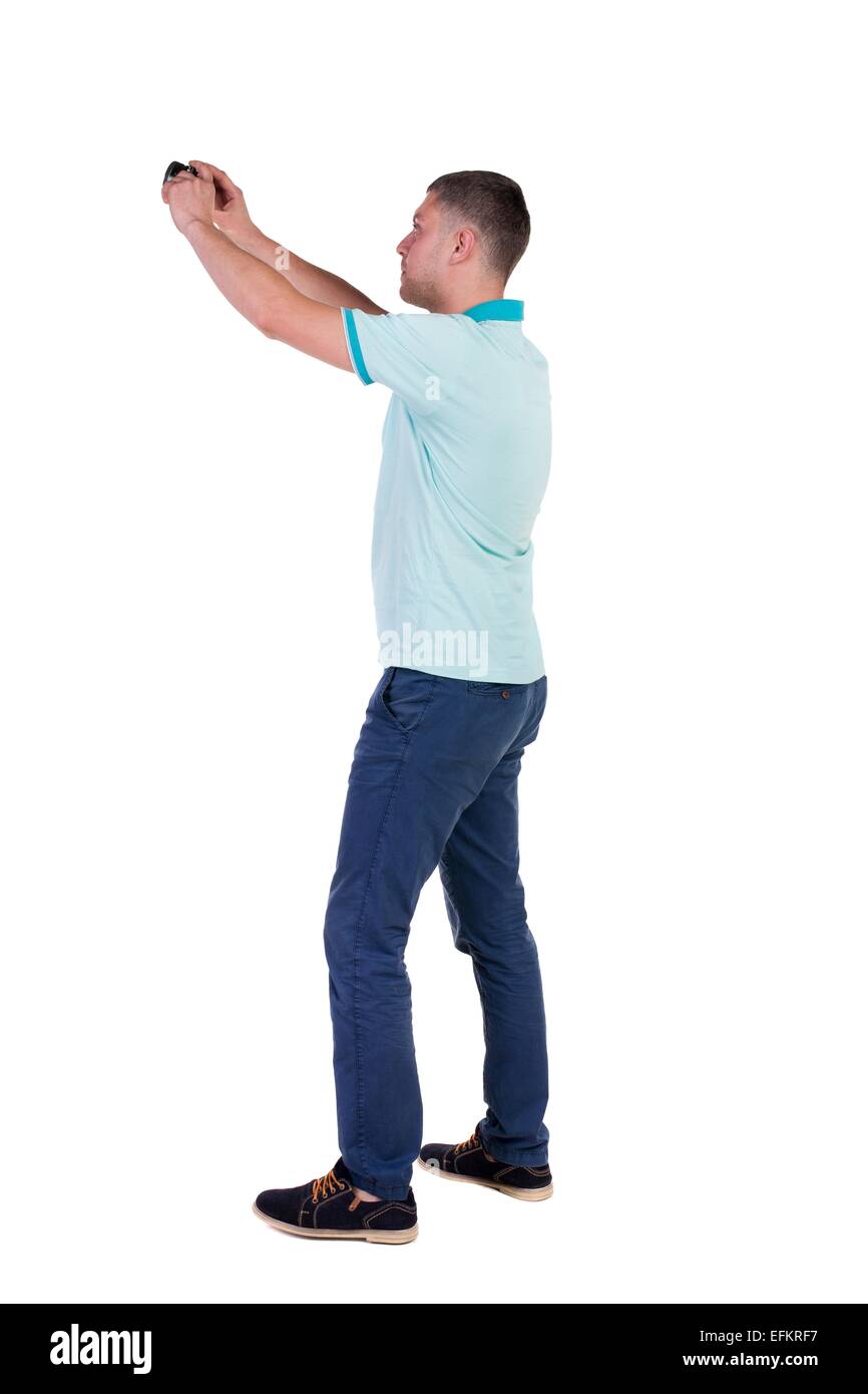 Back view of man photographing. tourist with camera. Rear view people ...