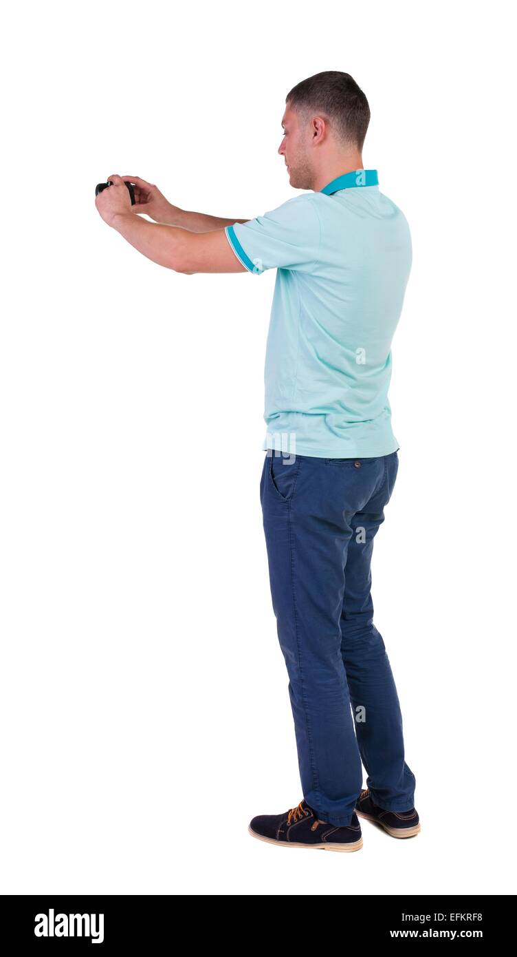 Back view of man photographing. tourist with camera. Rear view people ...