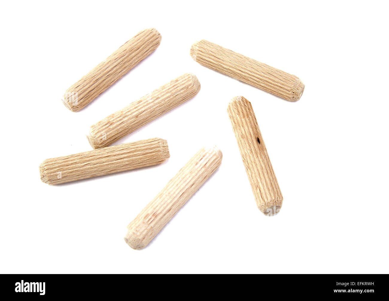 Close up of six wood dowels on white background Stock Photo - Alamy