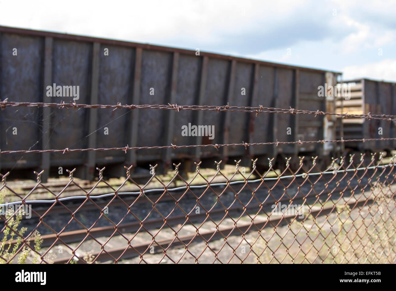 Barbed wire freight train Stock Photo - Alamy