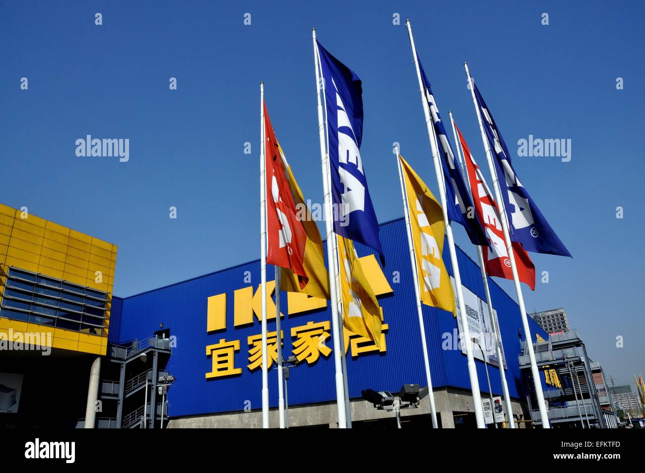 Chengdu, China Red, yellow, and blue signature flags fly in front of a ...