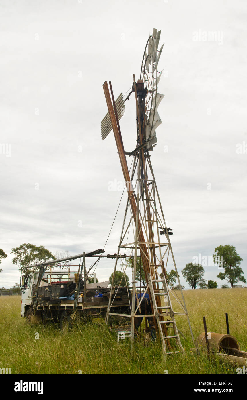 Repairman working on a rural windmill Stock Photo - Alamy