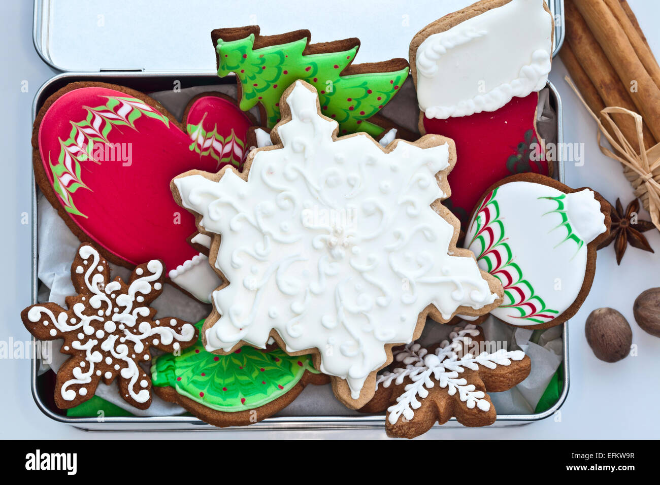 Festive iced gingerbread cookies in tin box Stock Photo - Alamy