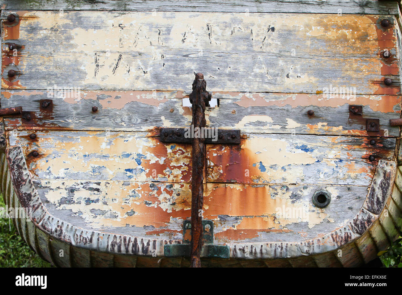 Rusty stern of an old wooden boat beached at coast, Scilly Isles, UK ...