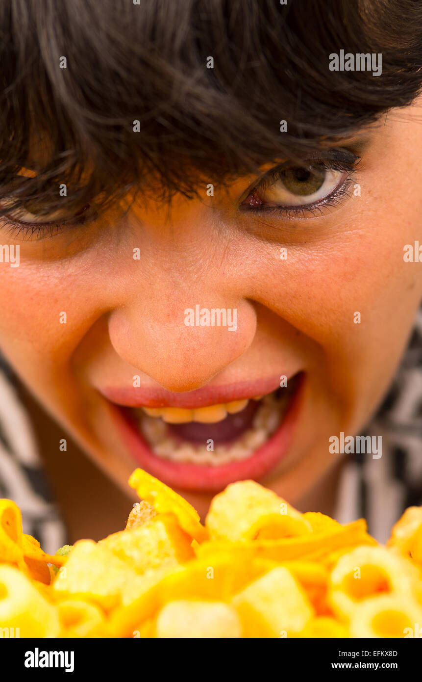 young girl overeating junk food Stock Photo - Alamy