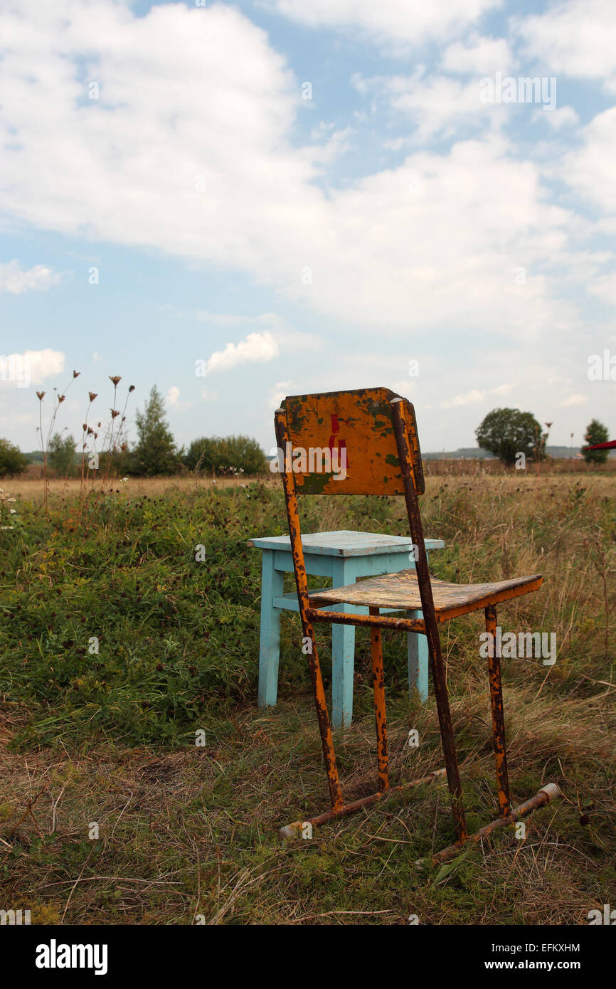 Two old rusty chairs in the field Stock Photo - Alamy