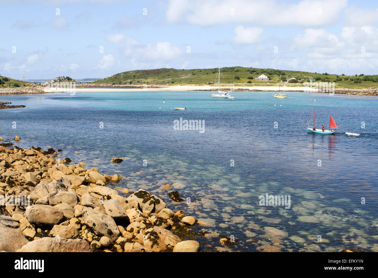 Sailing boats in rocky coastal bay, Isles of Scilly, Cornwall, UK Stock ...