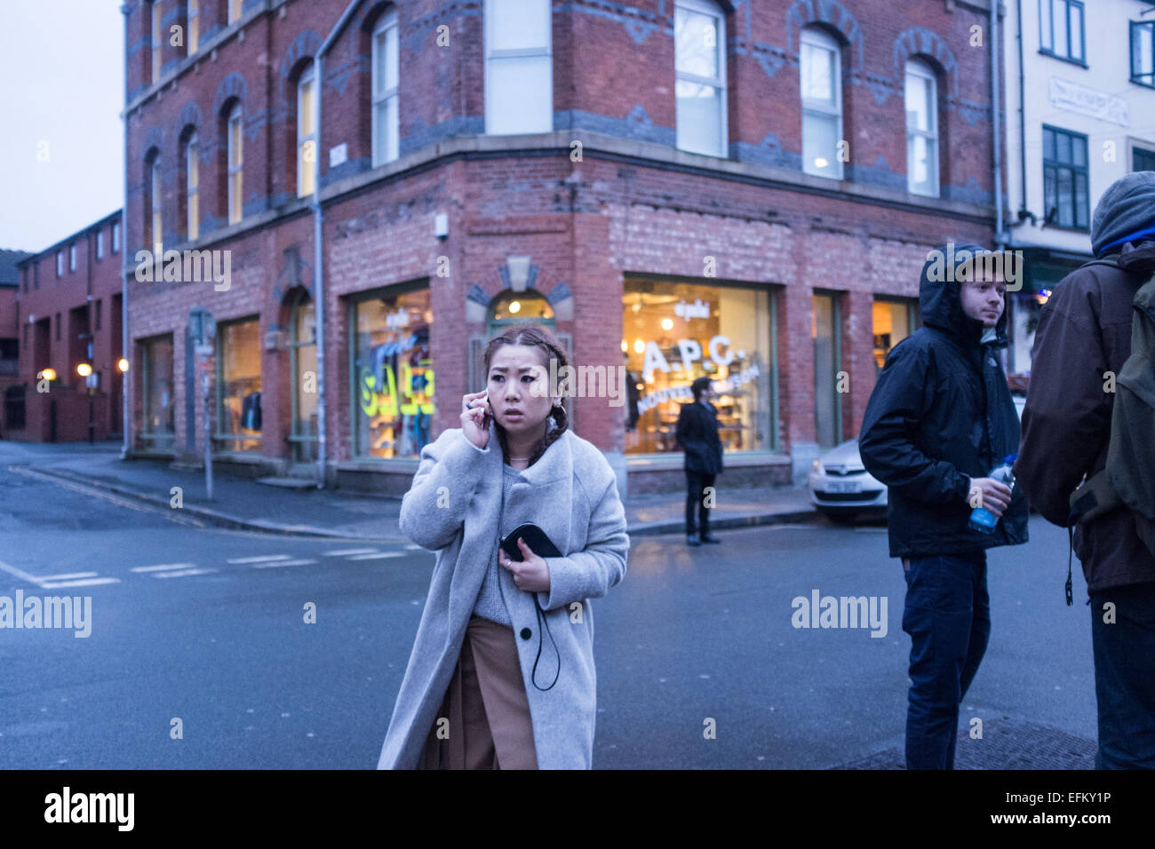 Girl calling in the street Stock Photo - Alamy