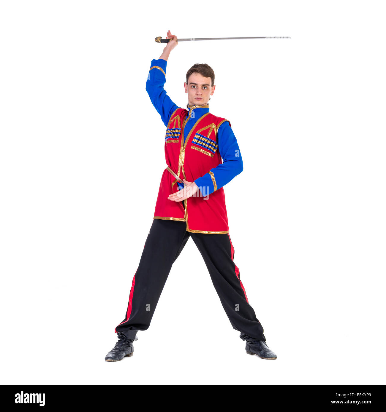 Russian cossack dance. Young dancer posing with sword Stock Photo - Alamy