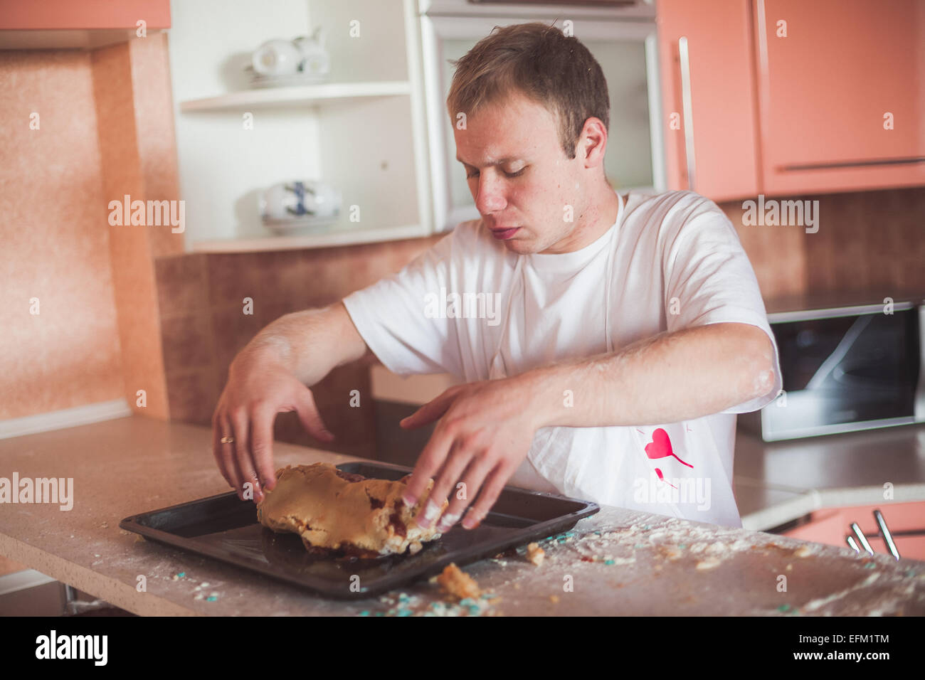 Man cooking at kitchen Stock Photo - Alamy