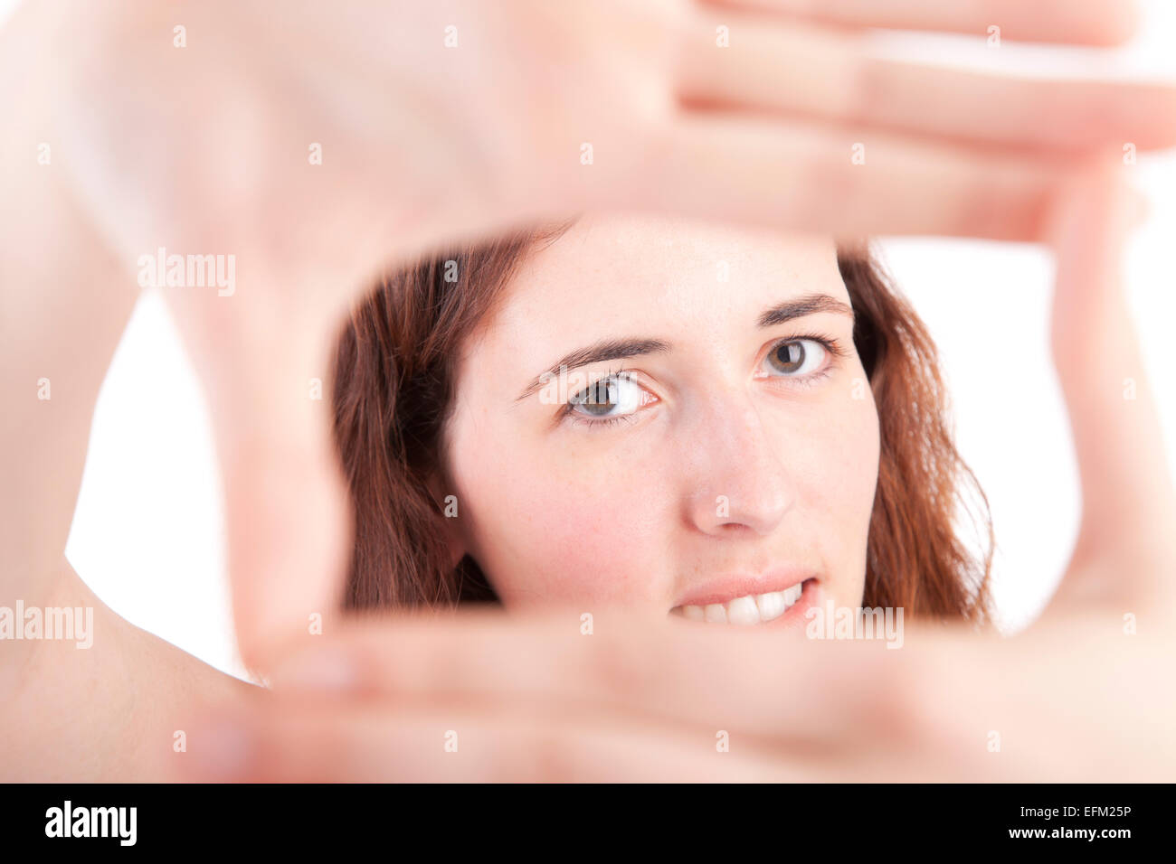 Woman showing framing hand gesture - focus on face Stock Photo - Alamy